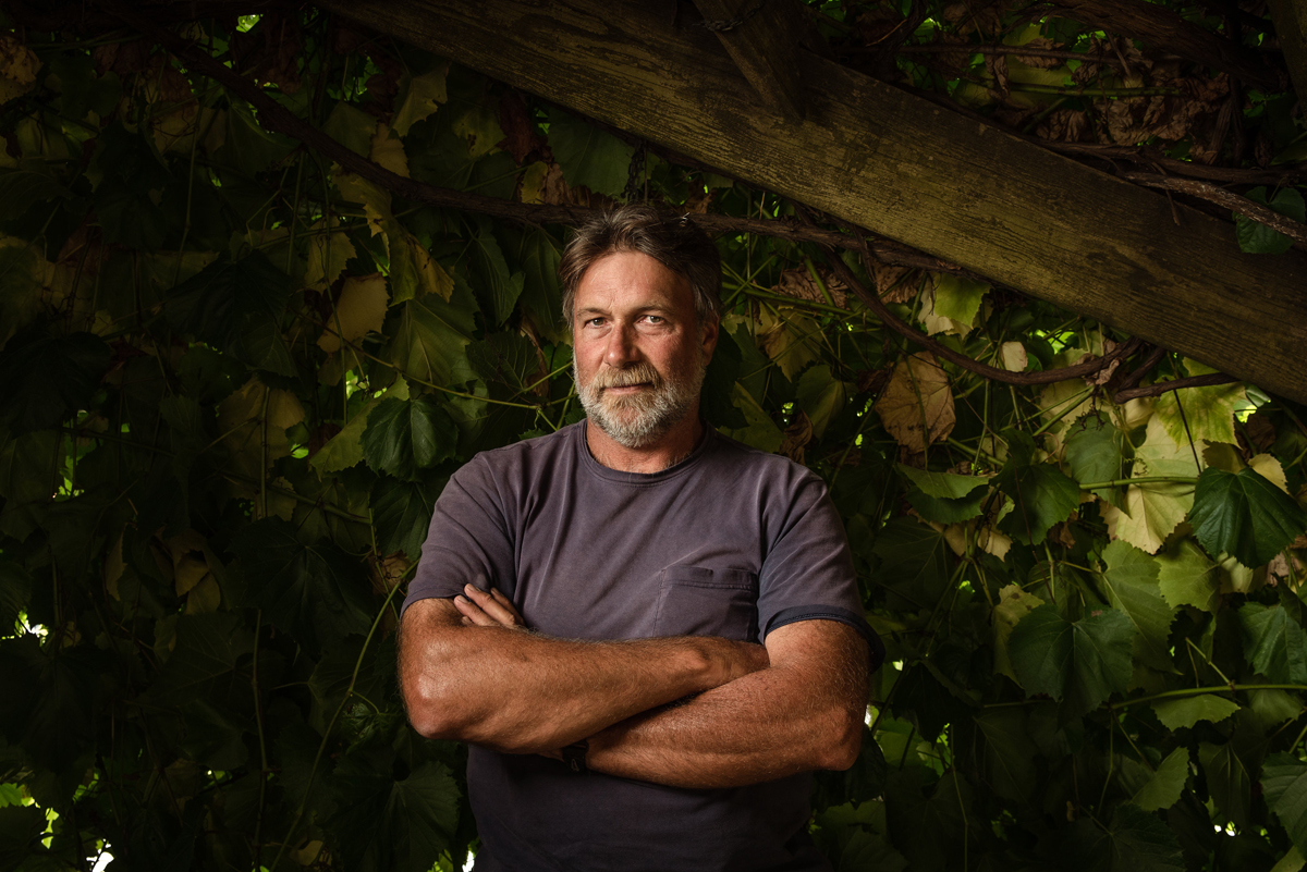 Behind the wine, vineyard managers work the fields to shape the ...